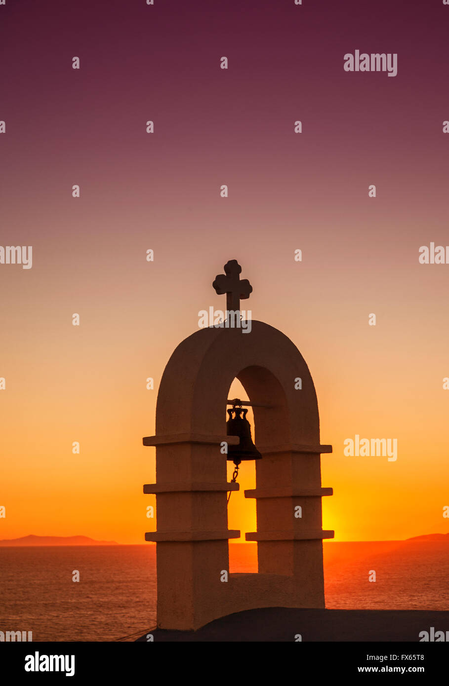 Bell arch with cross and sunset sky Stock Photo - Alamy