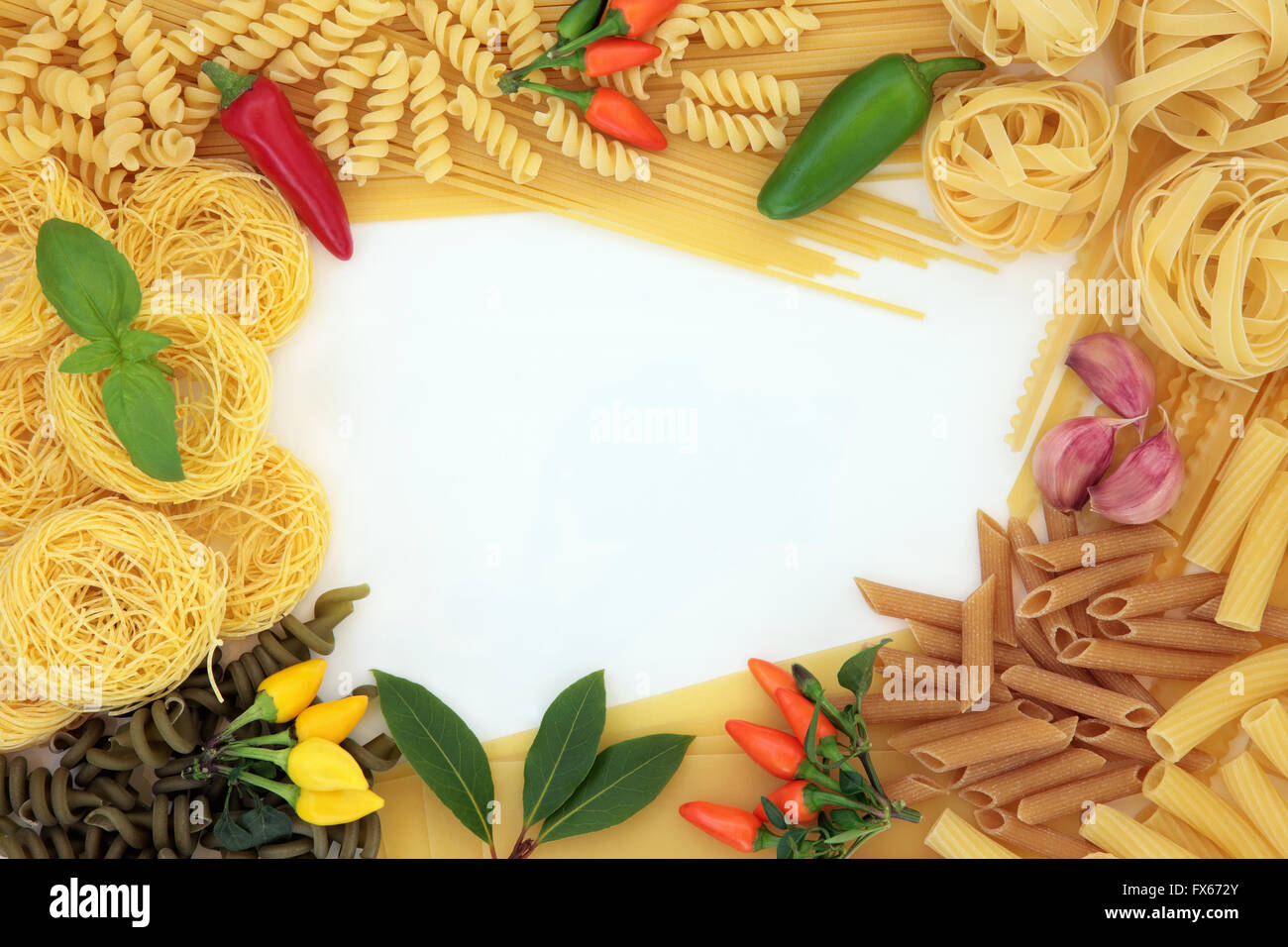 Pasta dried food abstract border with herbs and spices over white ...