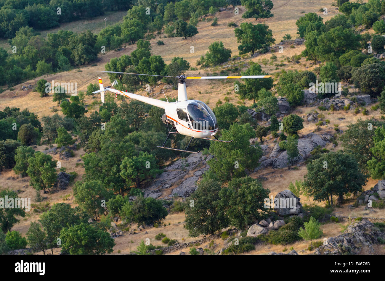 Aerial view of helicopter flying over remote landscape Stock Photo - Alamy