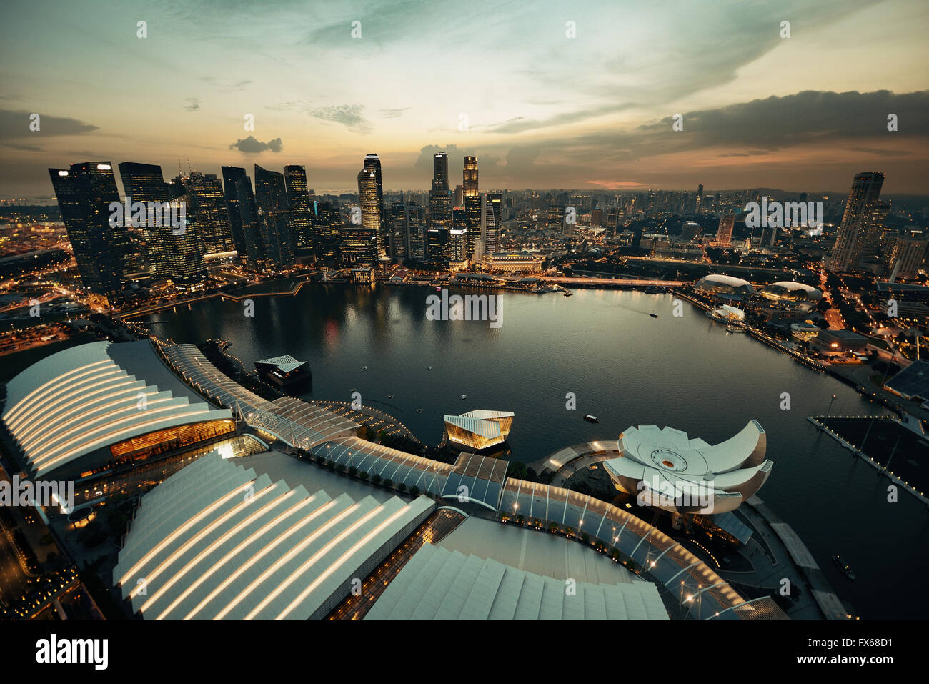 Singapore rooftop view of Marina Bay with urban skyscrapers at sunset ...