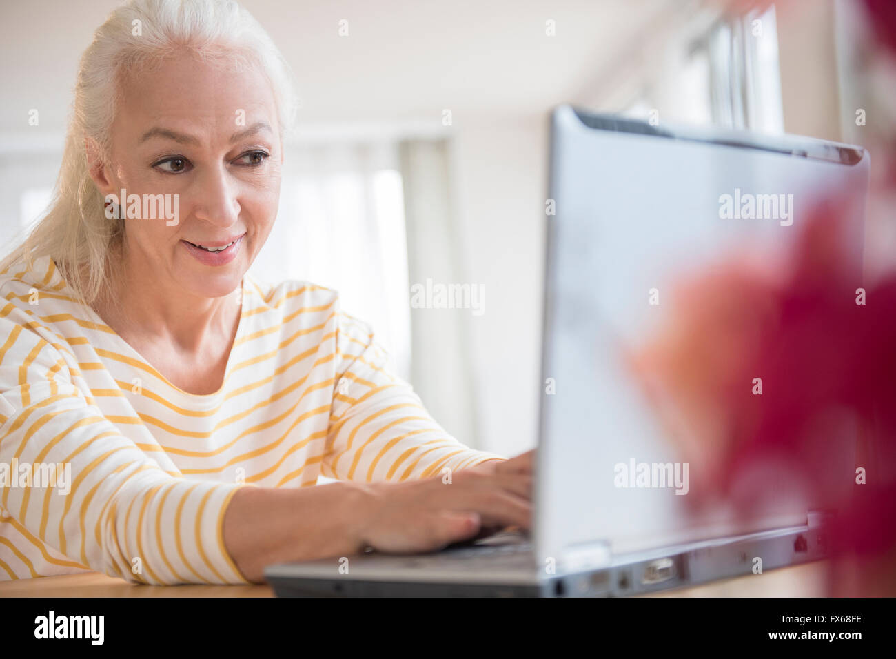 Caucasian woman using laptop Stock Photo - Alamy