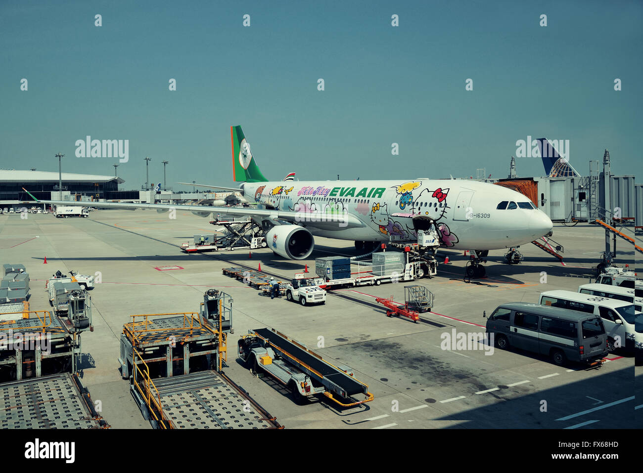 TOKYO, JAPAN - MAY 15: Airplane loading cargo at Narita airport on May ...