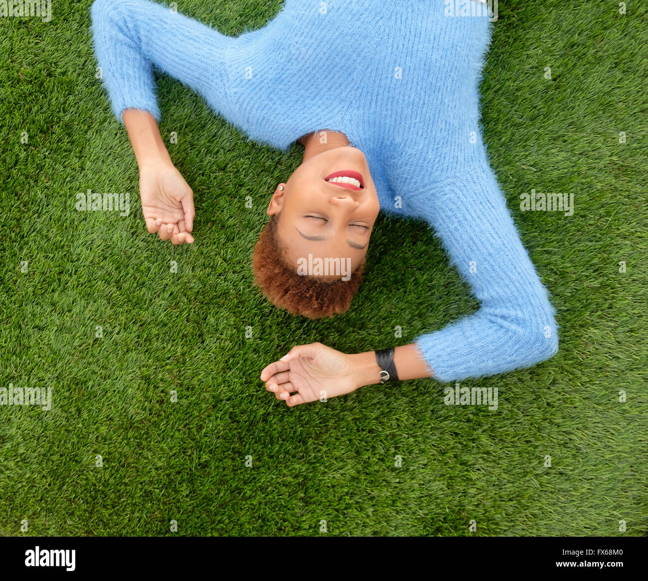 Black woman laying in grass hi-res stock photography and images - Alamy