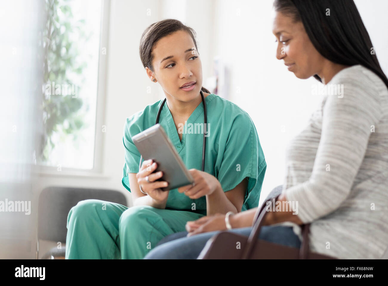 Nurse doctor consulting tablet hi-res stock photography and images - Alamy