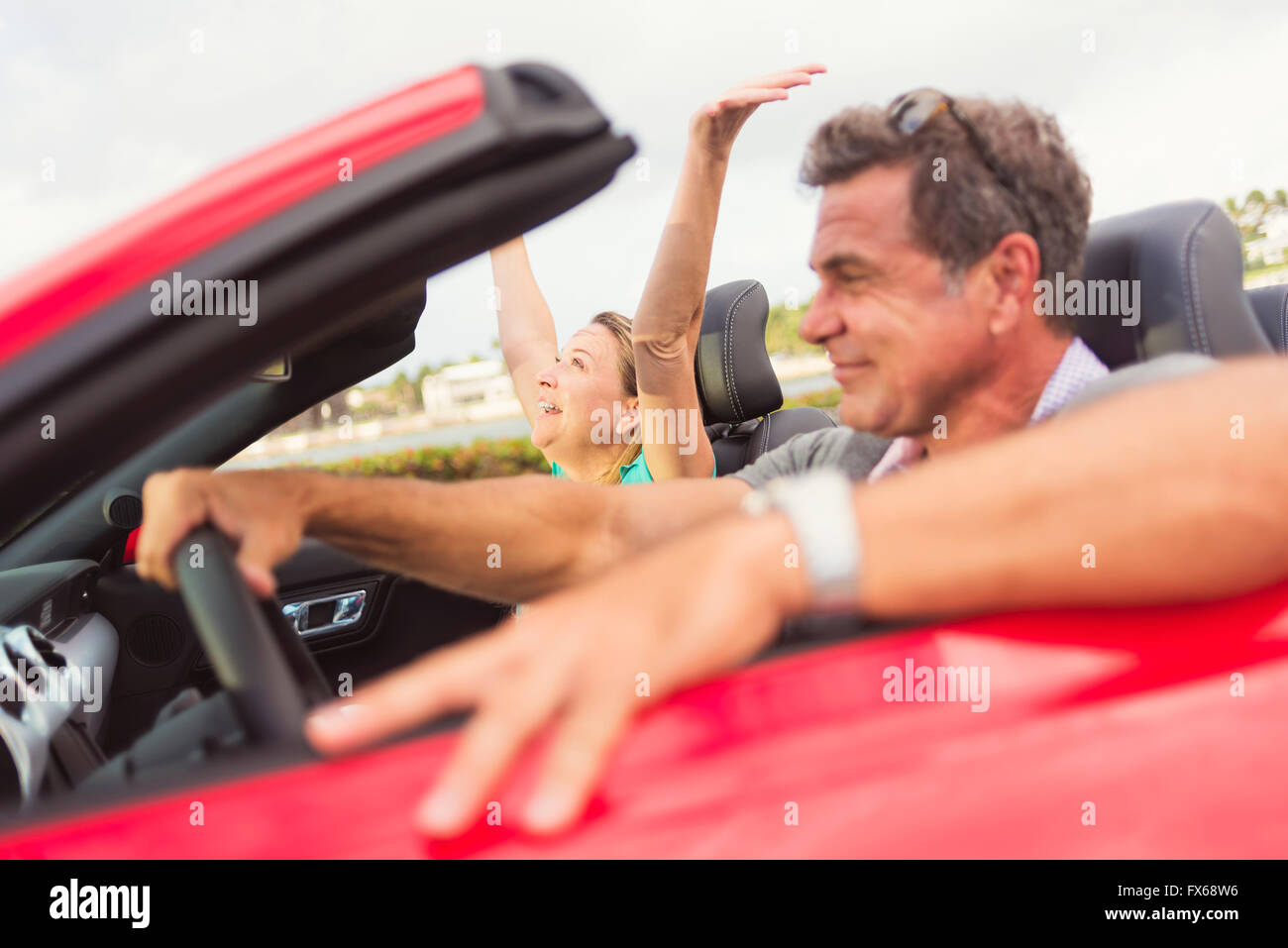 Women driving red convertible hi-res stock photography and images - Alamy