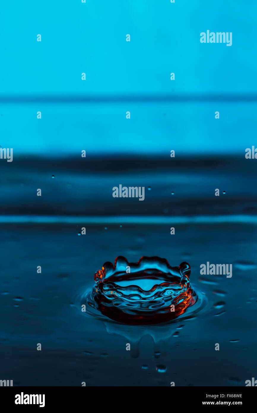 Beautiful colorful water splash from fallen drop Stock Photo - Alamy