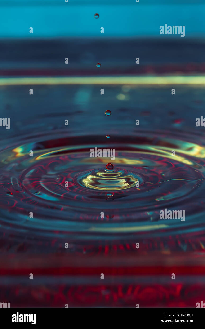 Beautiful colorful water splash from fallen drop Stock Photo - Alamy