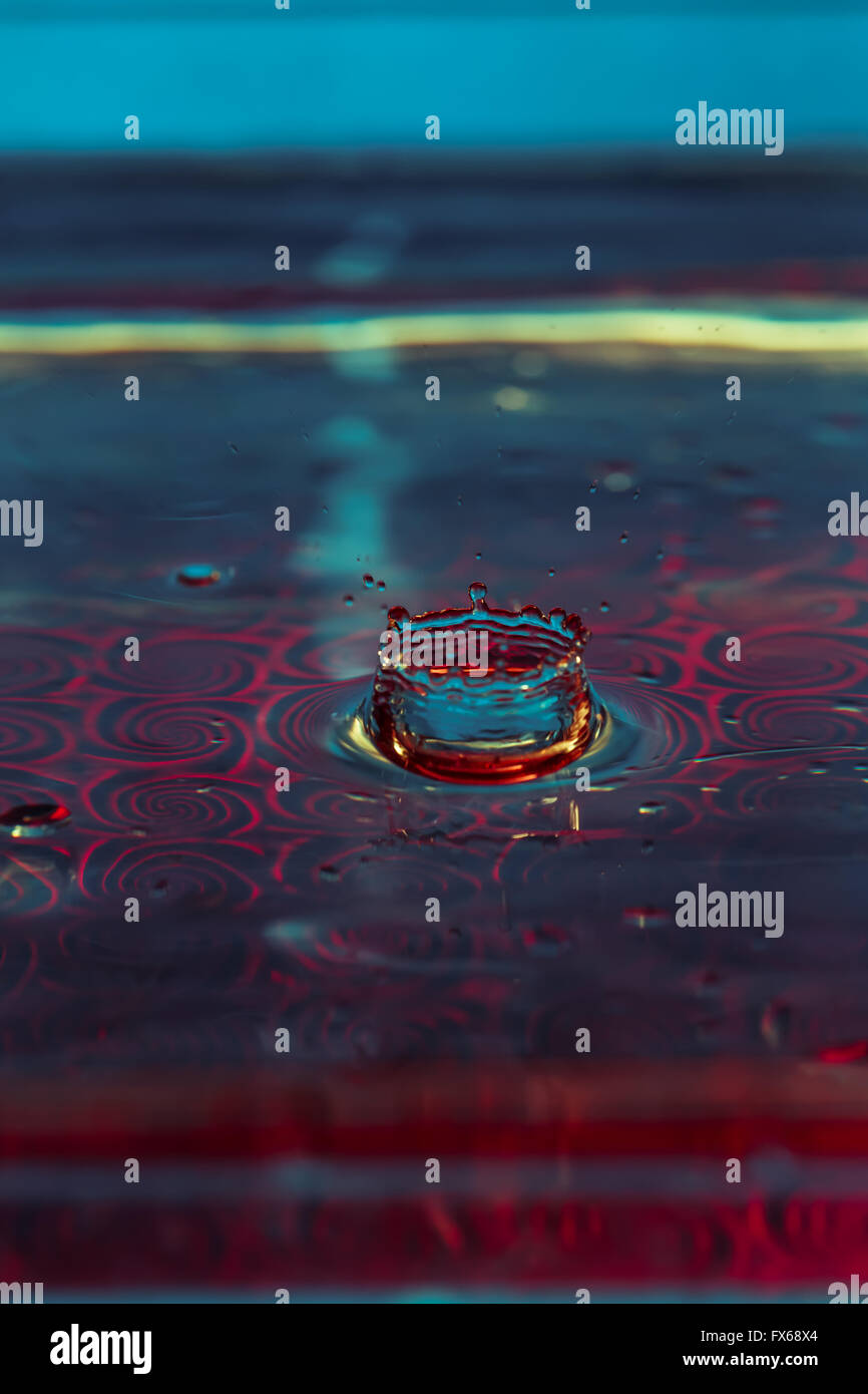 Beautiful colorful water splash from fallen drop Stock Photo - Alamy
