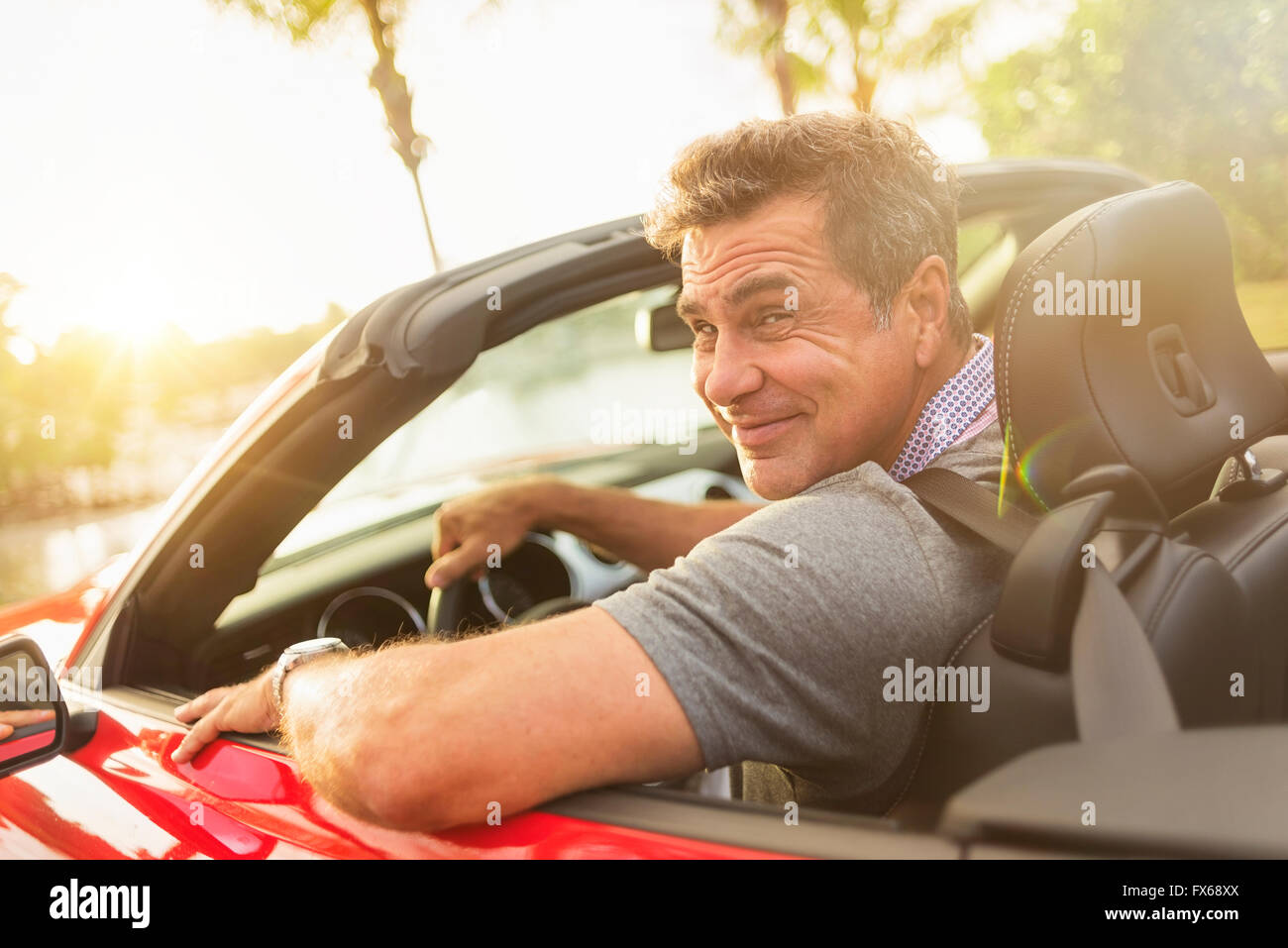 Caucasian man driving convertible Stock Photo - Alamy