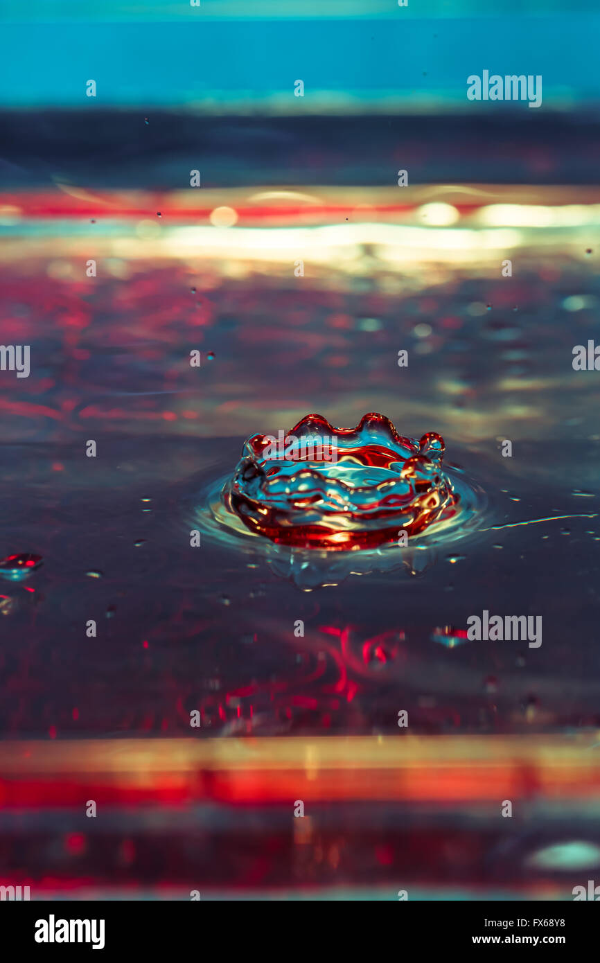 Beautiful colorful water splash from fallen drop Stock Photo - Alamy