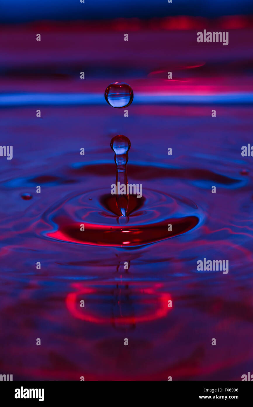 Beautiful colorful water splash from fallen drop Stock Photo - Alamy