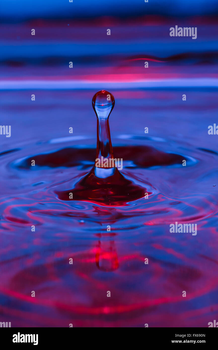 Beautiful colorful water splash from fallen drop Stock Photo - Alamy