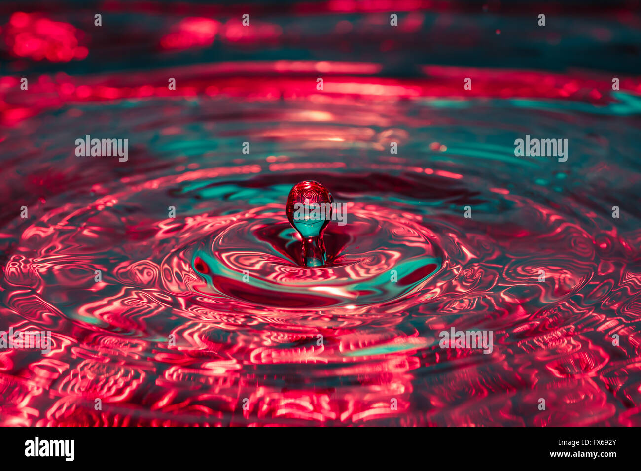 Beautiful colorful water splash from fallen drop Stock Photo - Alamy