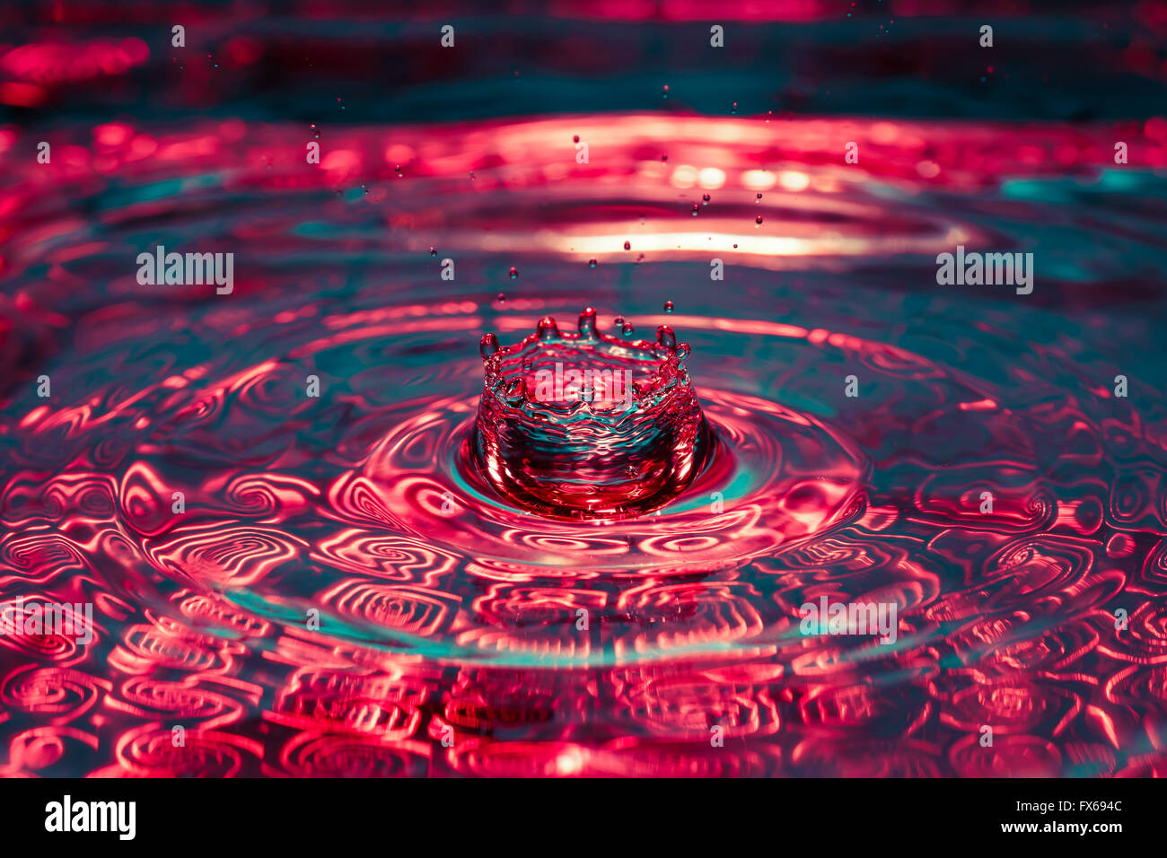 Beautiful colorful water splash from fallen drop Stock Photo - Alamy
