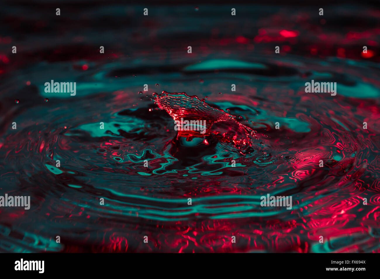 Beautiful colorful water splash from fallen drop Stock Photo - Alamy