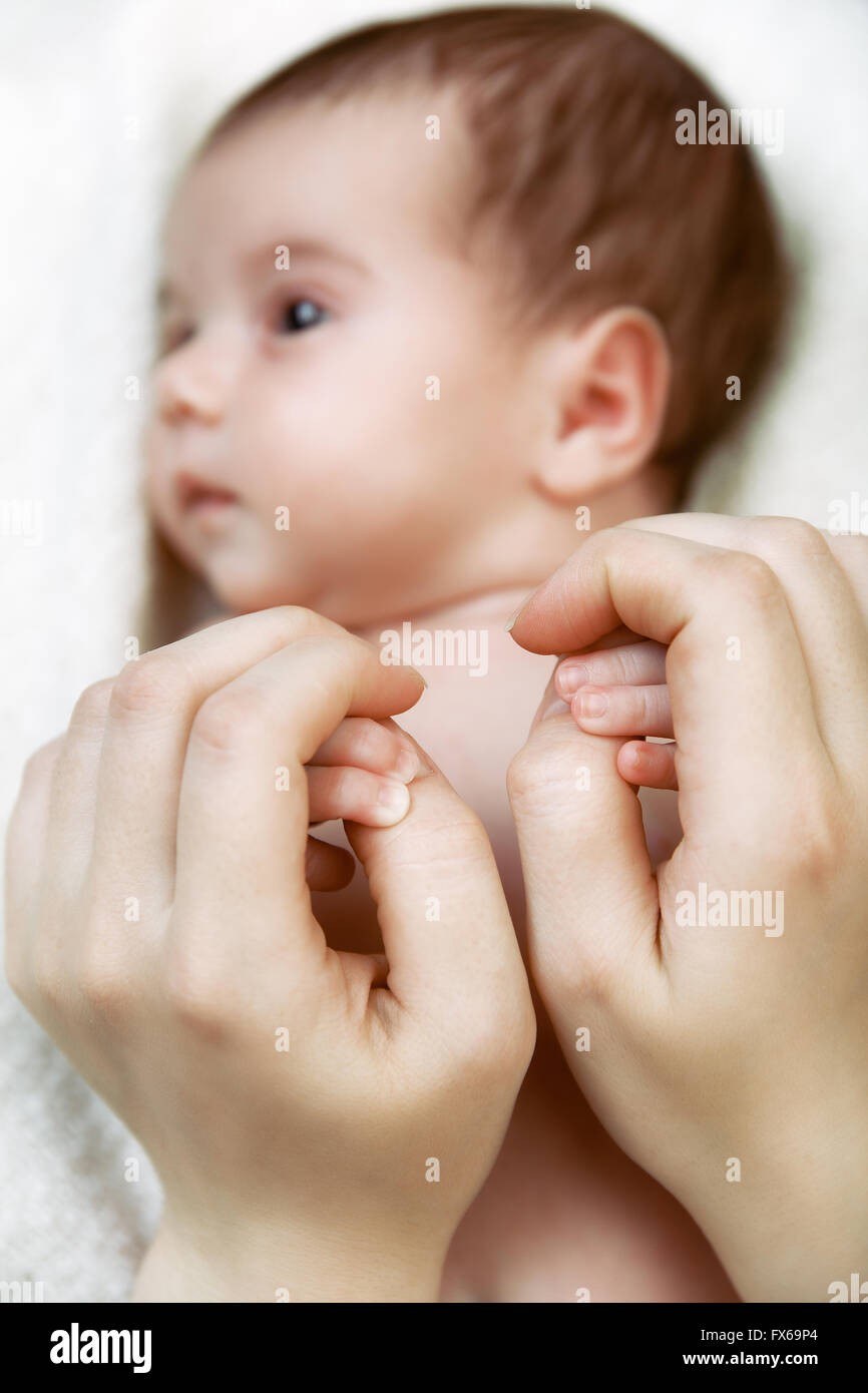 Little palms of newborn baby in mother's hands Stock Photo - Alamy