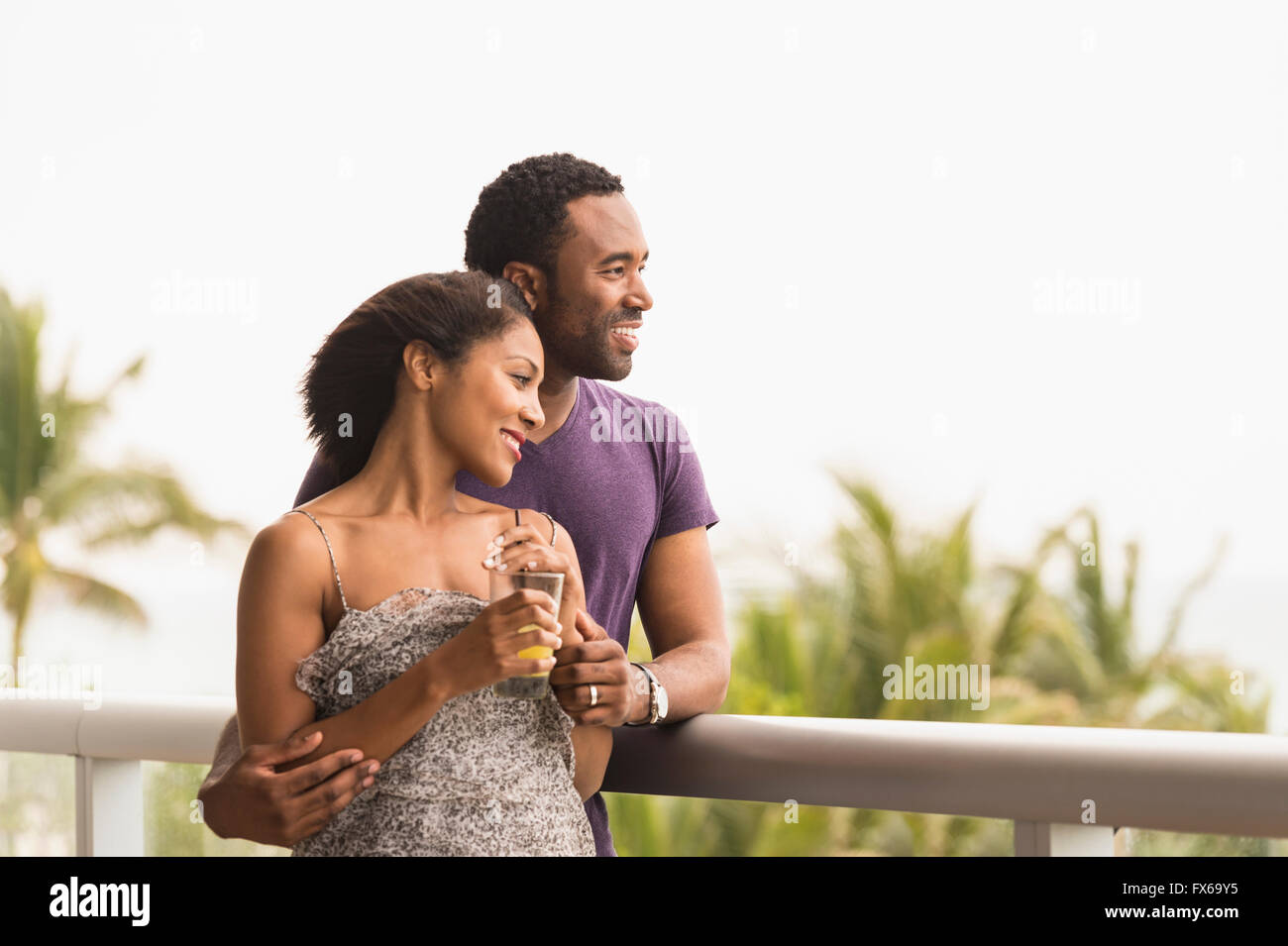 Back young woman standing balcony looking view hi-res stock photography ...