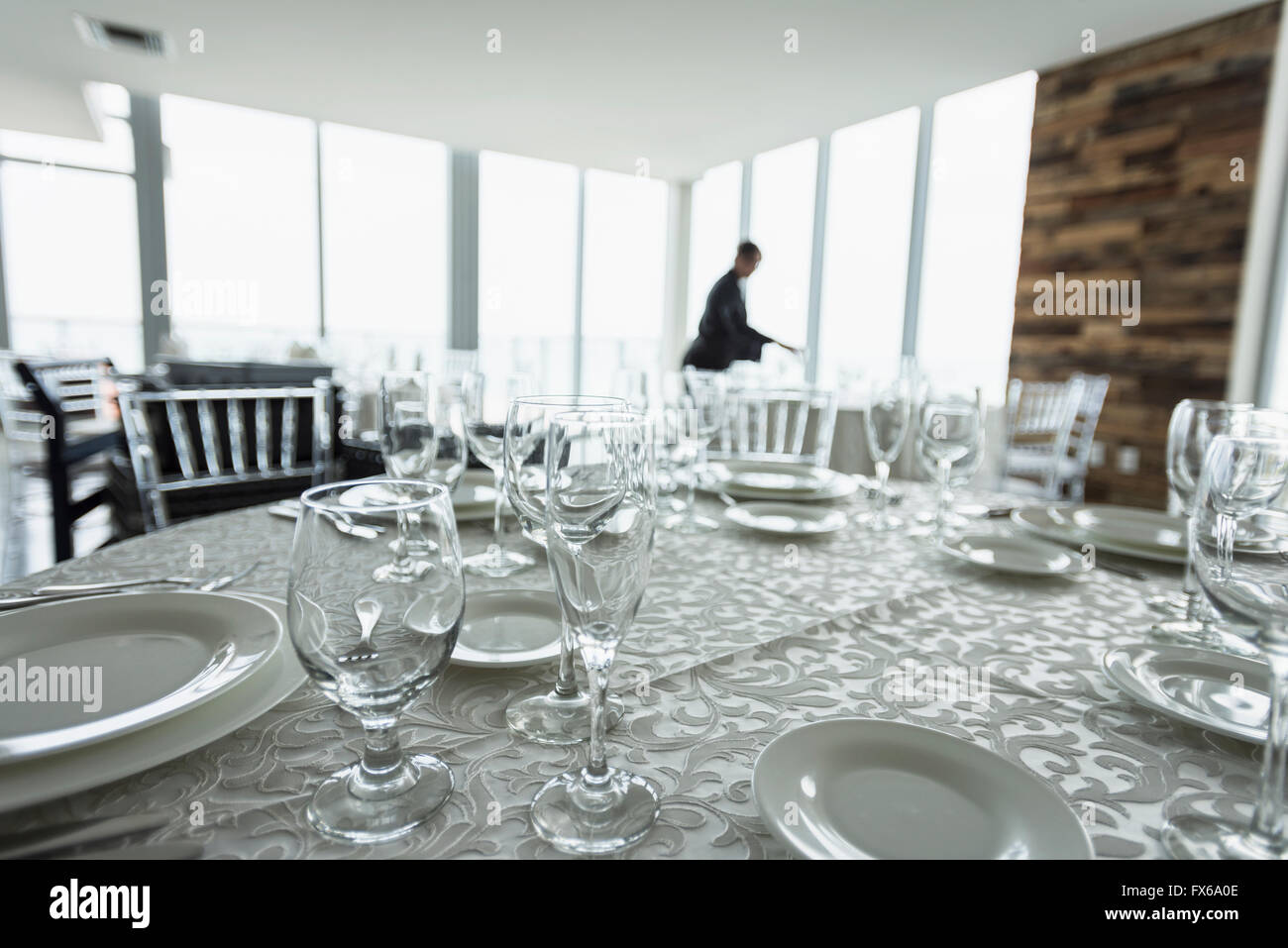 Table setting in empty restaurant Stock Photo - Alamy