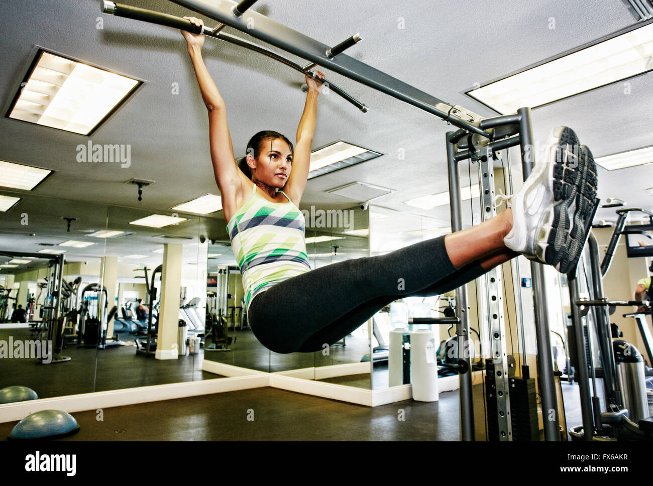 Woman doing pull ups hi-res stock photography and images - Alamy