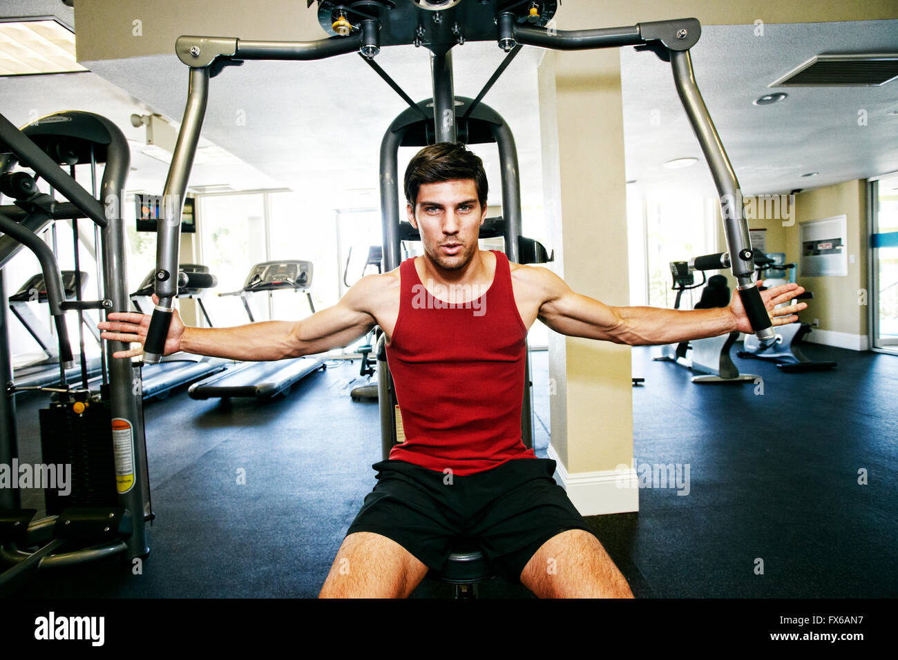 Caucasian man working out in gymnasium Stock Photo - Alamy