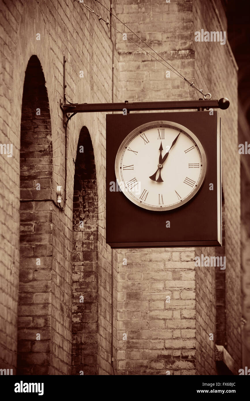 Urban historical architecture with vintage clock in street in London ...