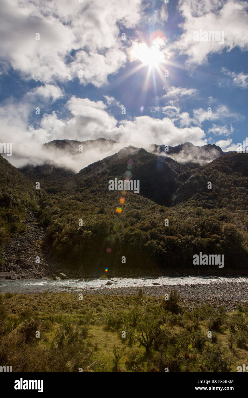 Mountains and river in remote landscape Stock Photo - Alamy