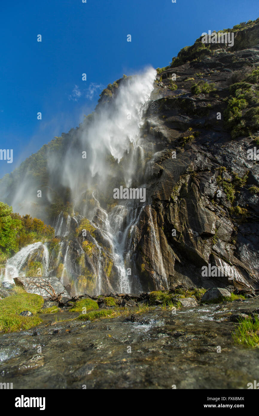 Waterfall pouring over remote cliff Stock Photo - Alamy