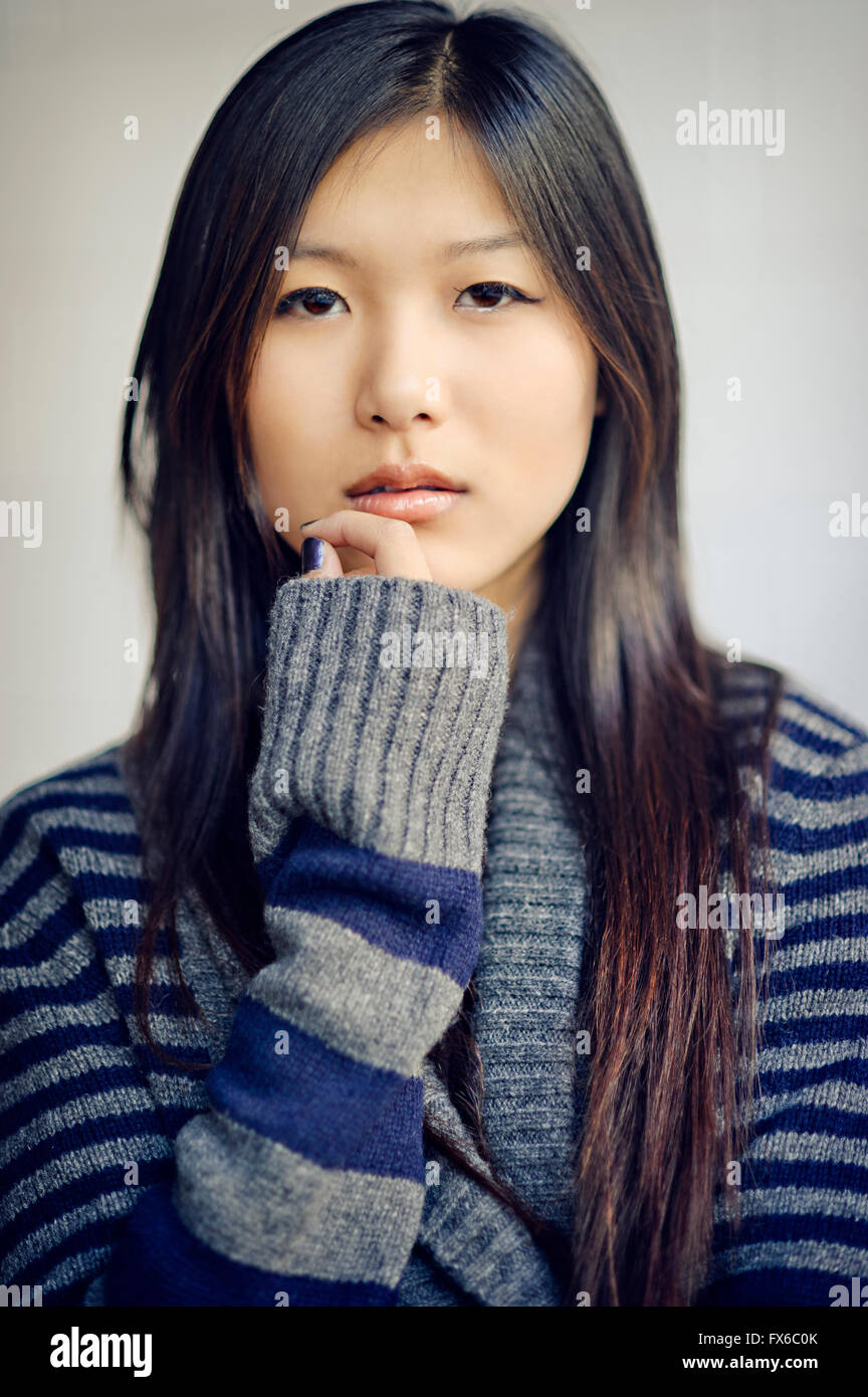 Asian woman with serious expression Stock Photo - Alamy