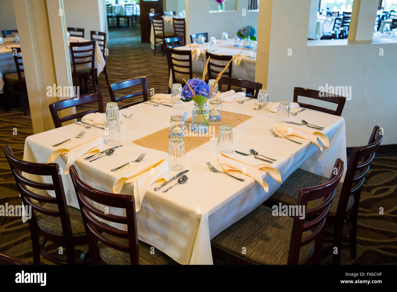 Wedding reception at a fancy restaurant indoors with nice tables and ...