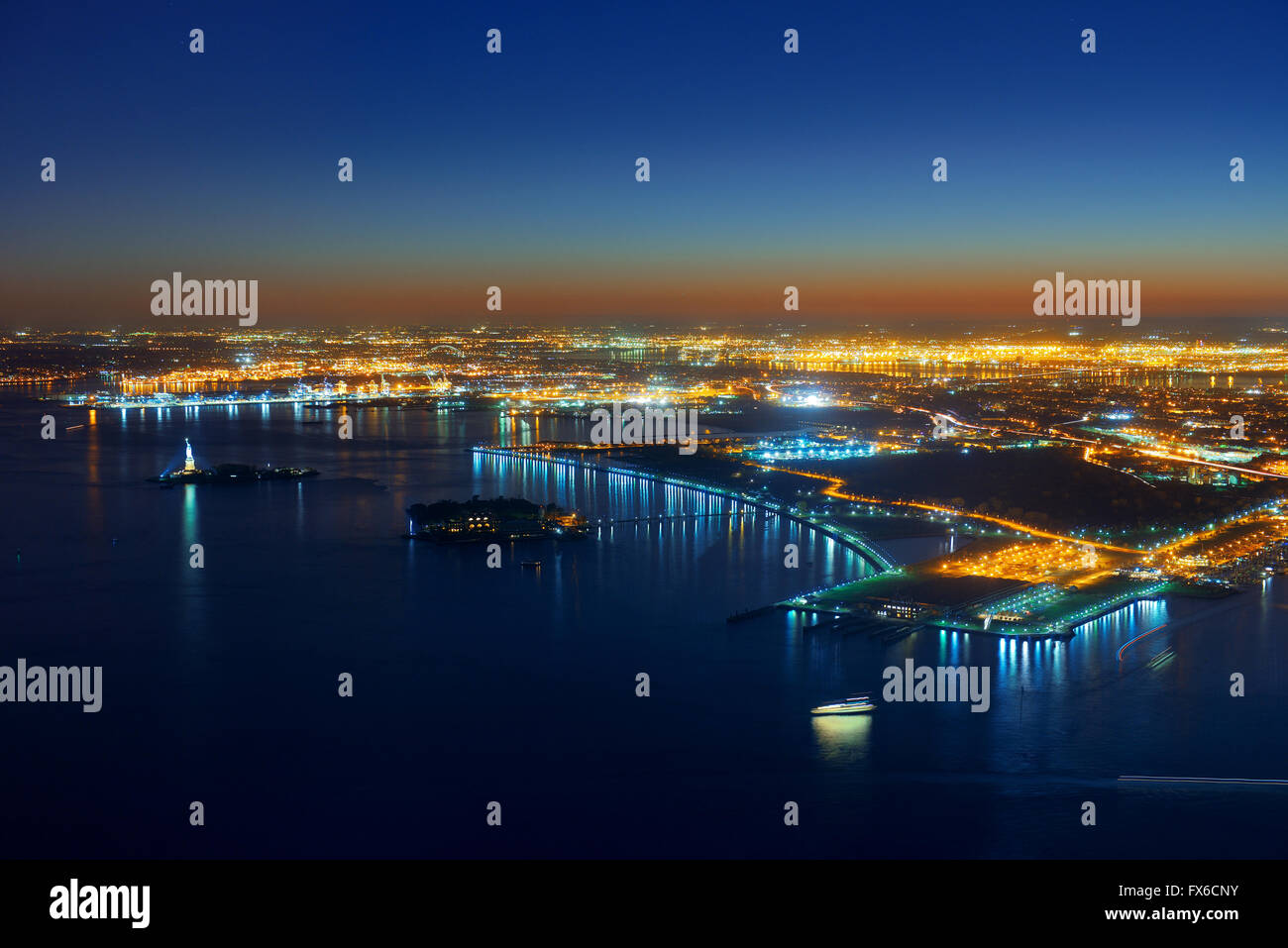 Rooftop night view of New Jersey from Manhattan downtown with urban ...