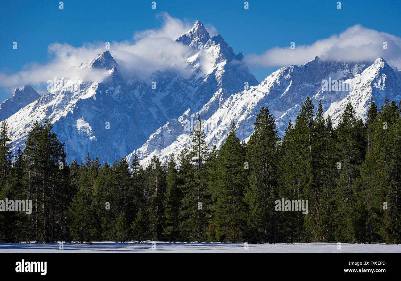 Winter scene of clouds surrounding the peak of mount Moran in Grand ...