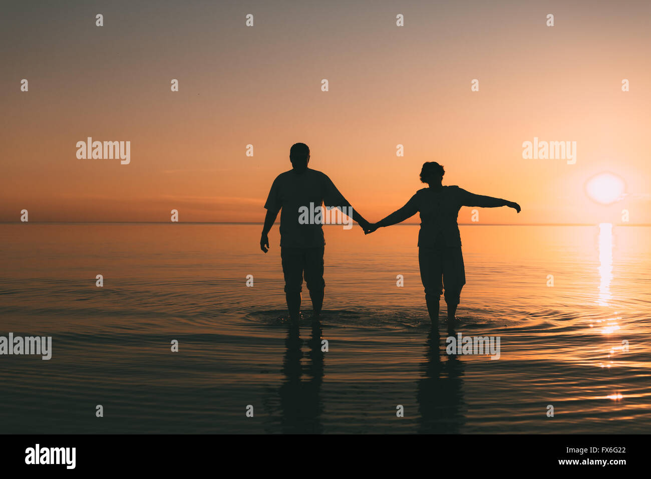 Silhouettes man woman in evening hi-res stock photography and images ...