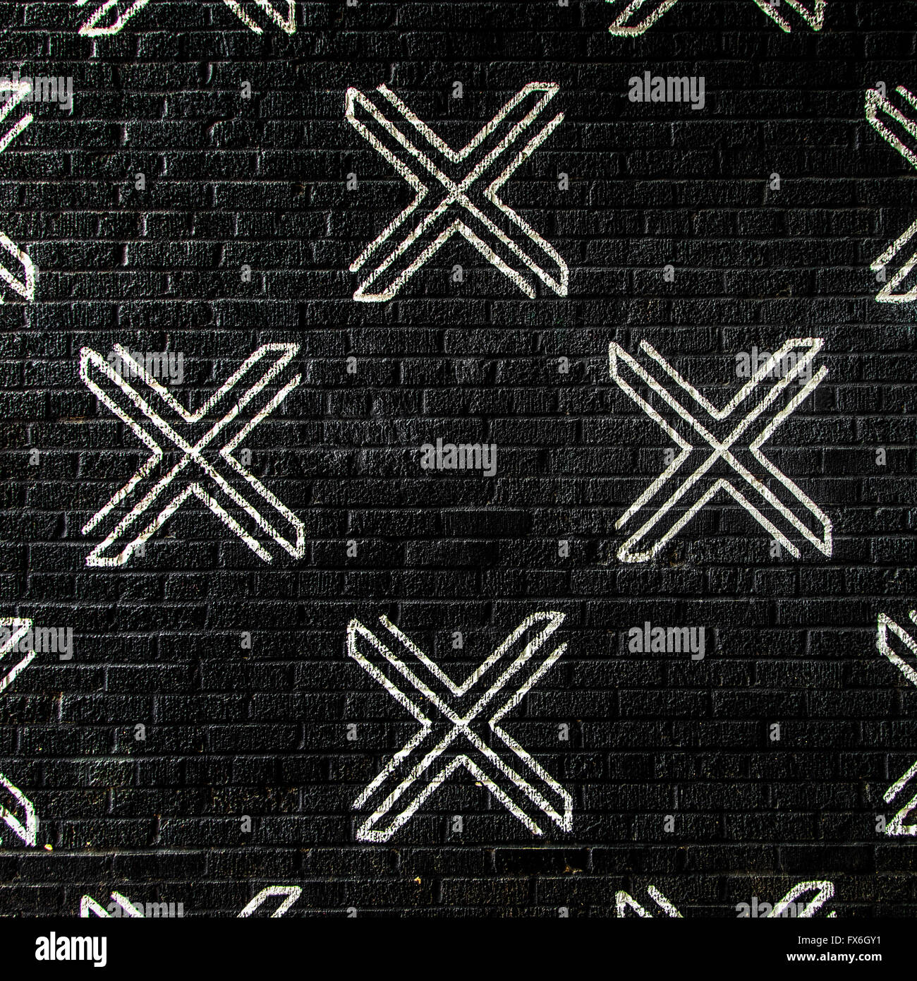 Pattern of X's on a Brick Wall Stock Photo - Alamy
