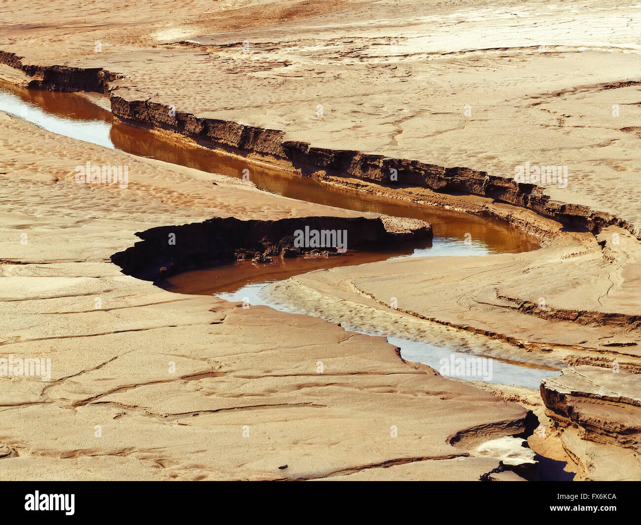 Eroded land with canals at industrial waste area Stock Photo - Alamy
