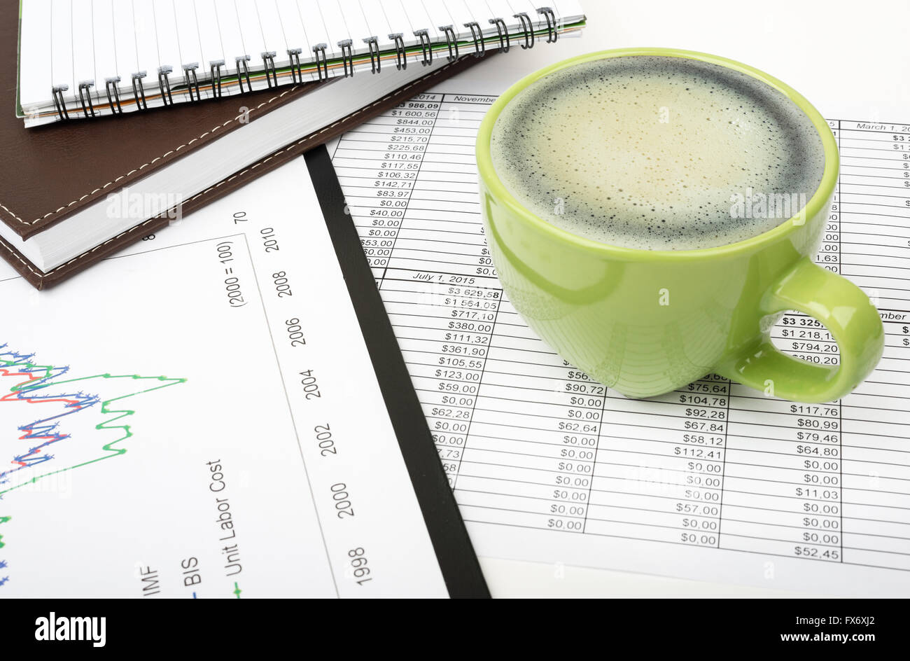Notebook with coffee Stock Photo - Alamy