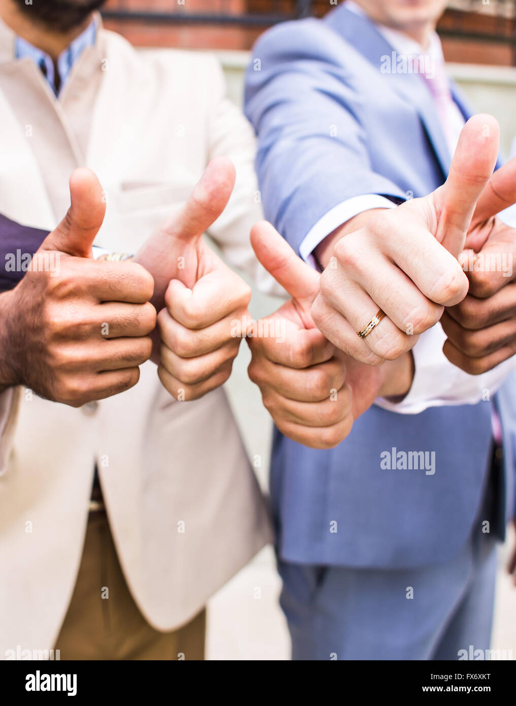 cheerful business group giving thumbs up Stock Photo - Alamy