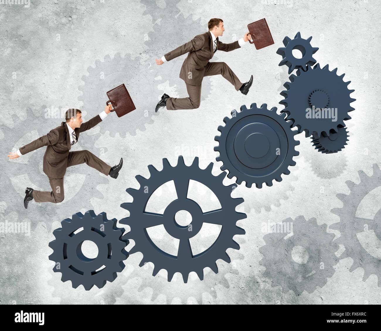 Two businessmen running on wheel gears Stock Photo - Alamy