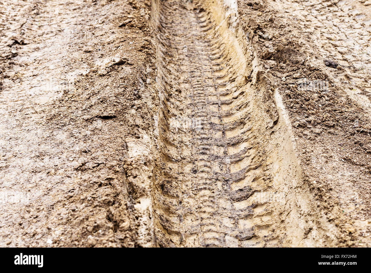 deep ruts of automobile wheels in loamy soil of country road in spring ...