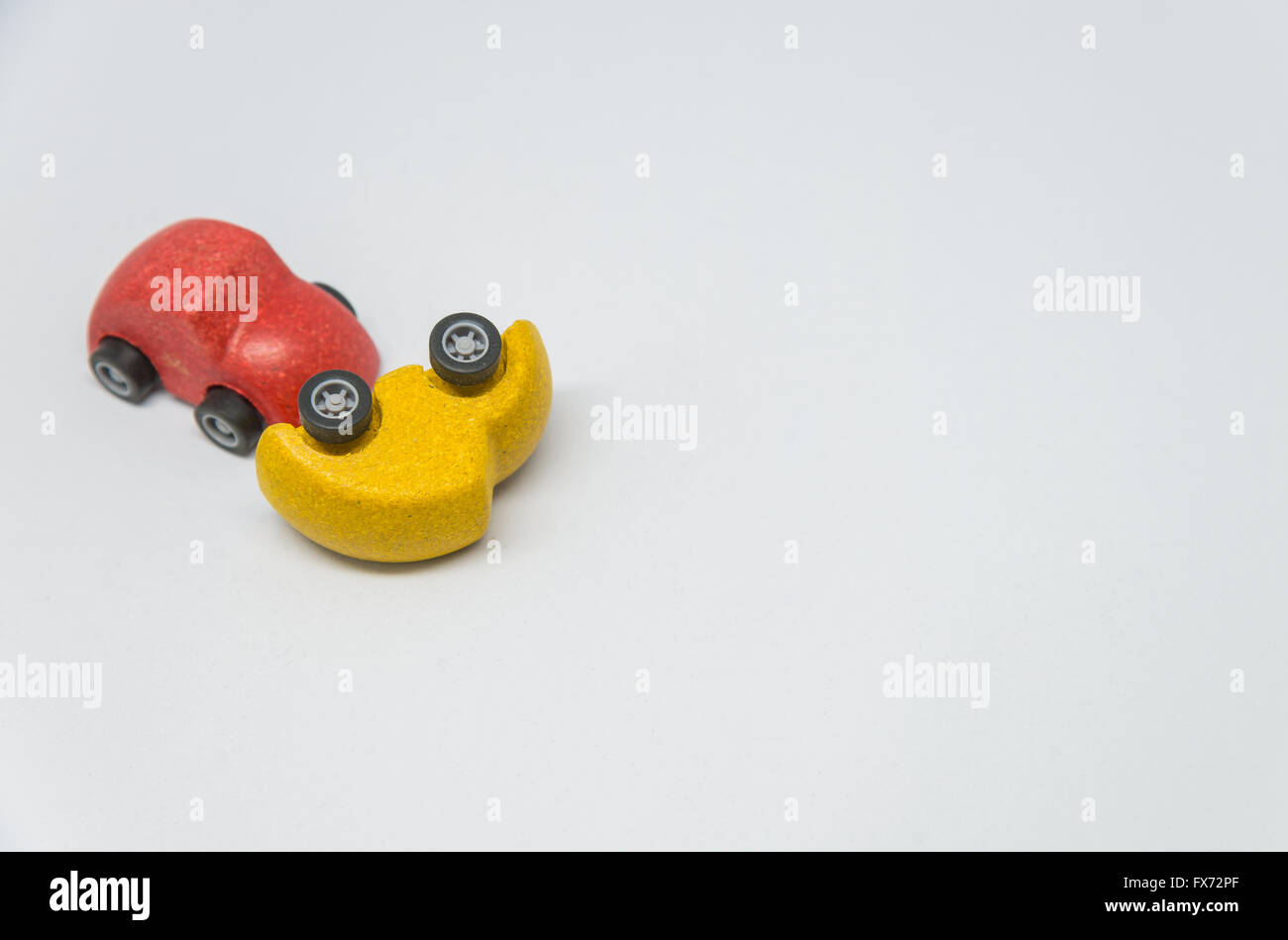 Red toy car crashed yellow toy car accident with white background Stock ...