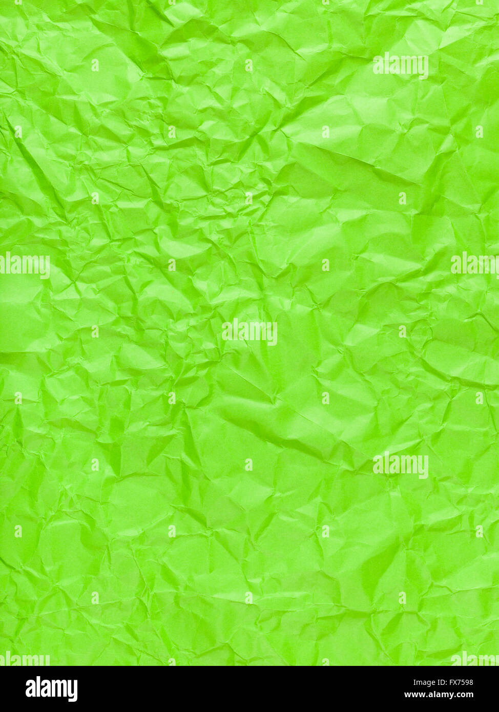 vertical background from green colour crumpled paper Stock Photo - Alamy