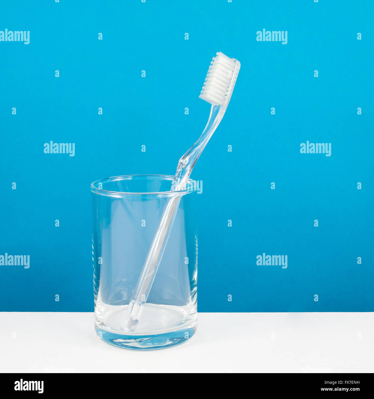 The clear toothbrush with small glass for brushing the teeth Stock ...