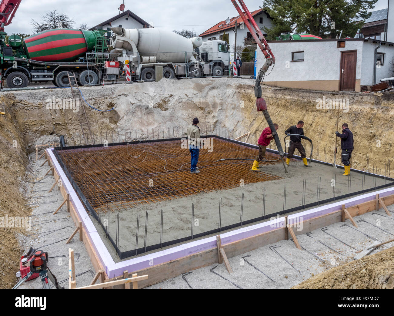 Construction worker during concrete pouring work at the construction ...