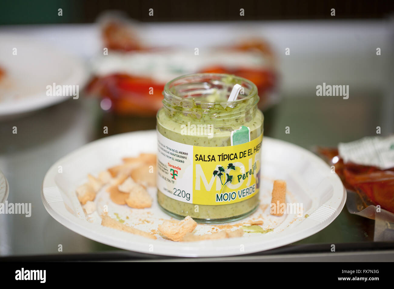 canarian green mojo sauce open jar on a white dish Stock Photo - Alamy