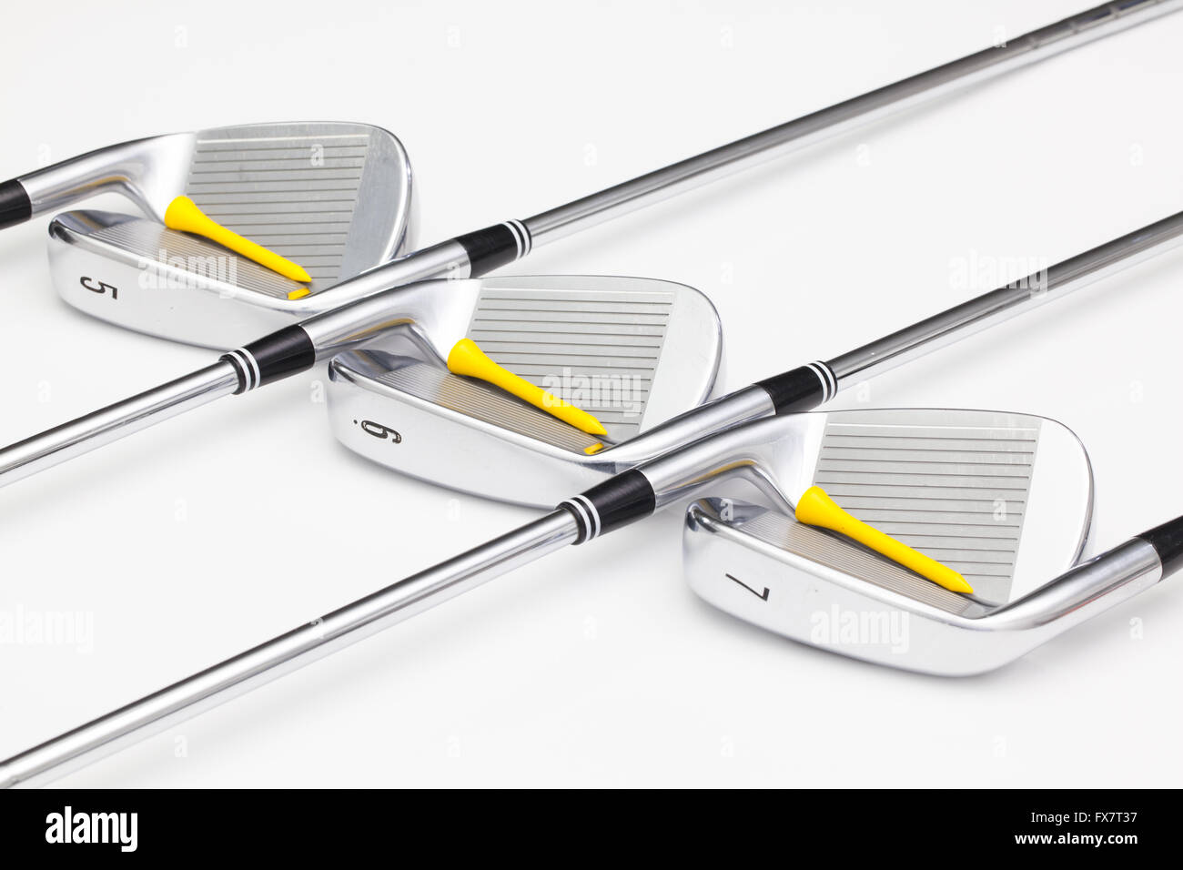 Titanium golf clubs on the white background Stock Photo - Alamy