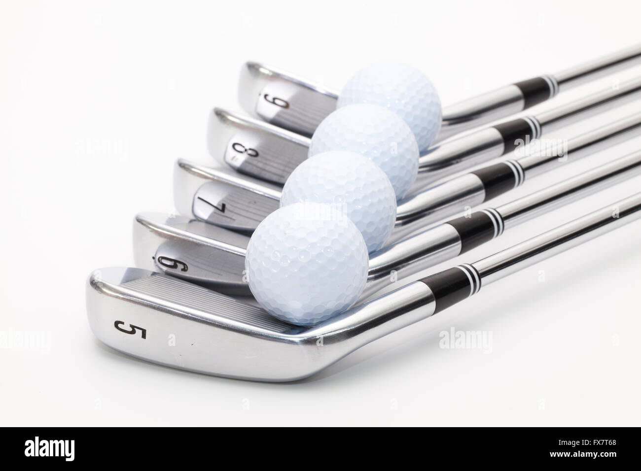 Titanium golf clubs on the white background Stock Photo - Alamy