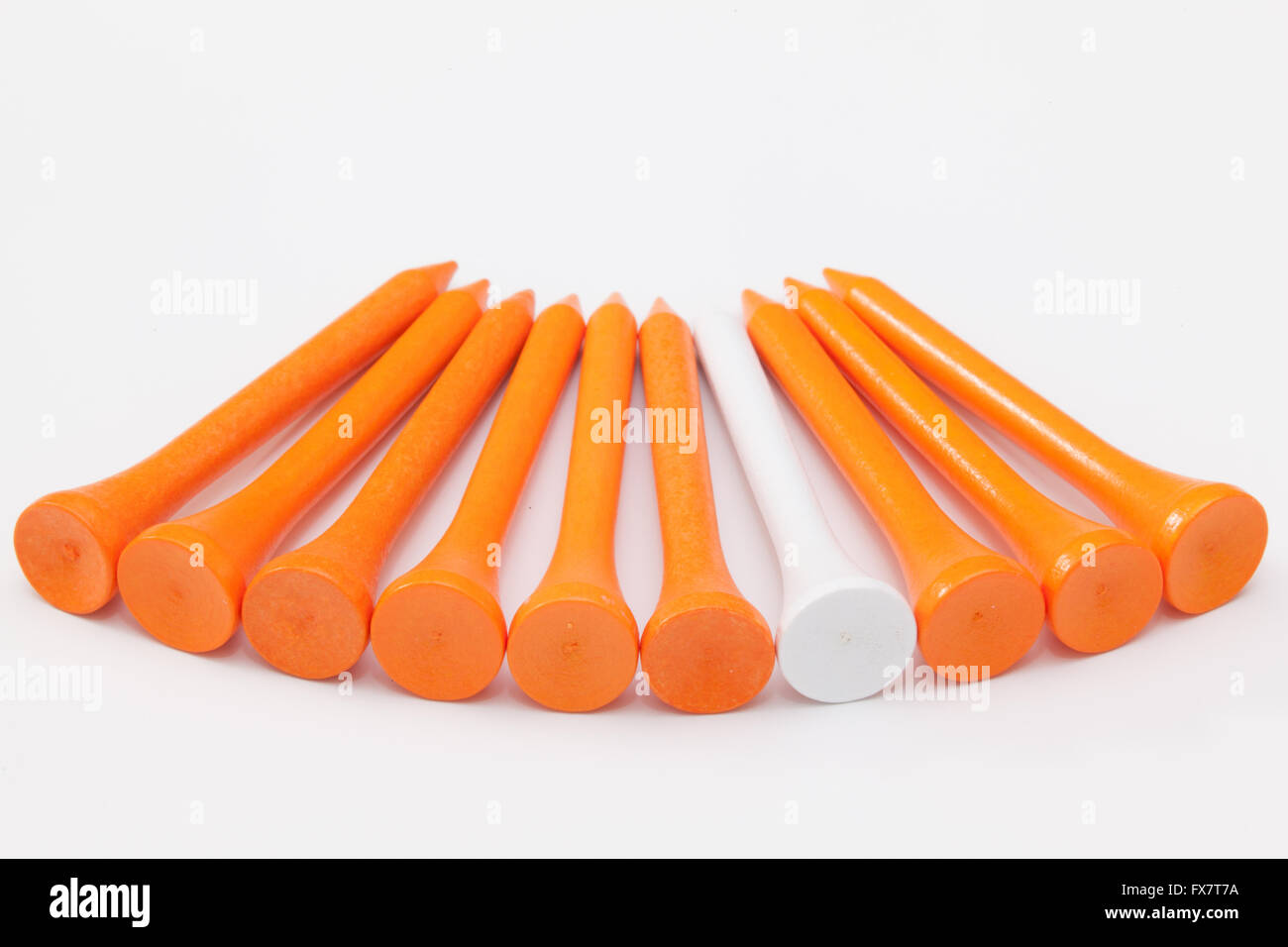 Wooden golf tees on the white background Stock Photo - Alamy