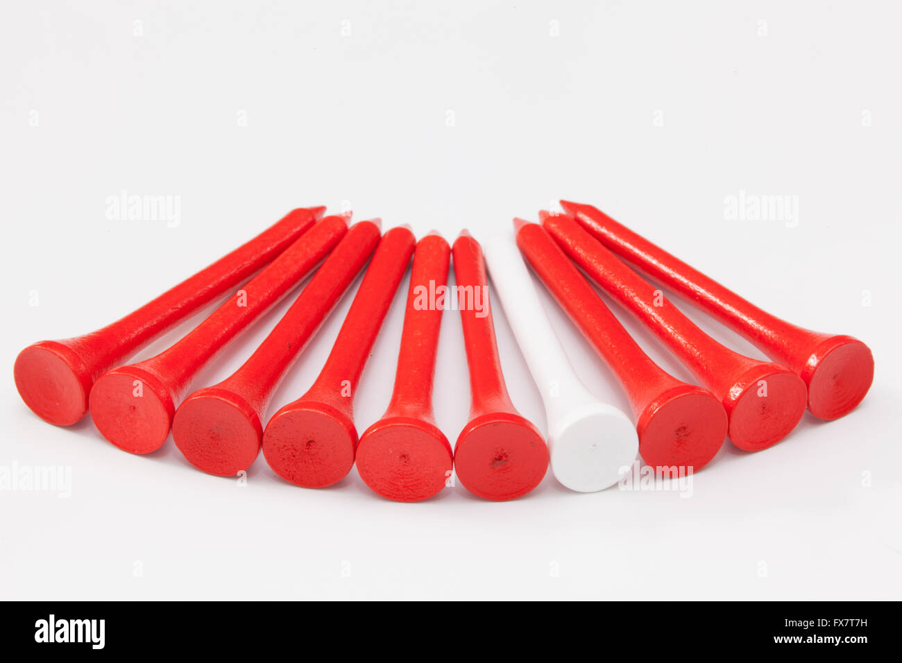 Wooden golf tees on the white background Stock Photo - Alamy