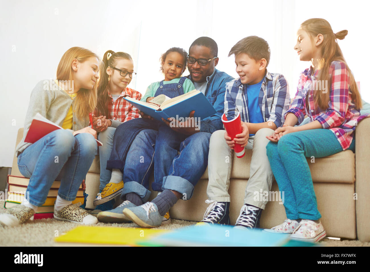 Reading in group Stock Photo - Alamy