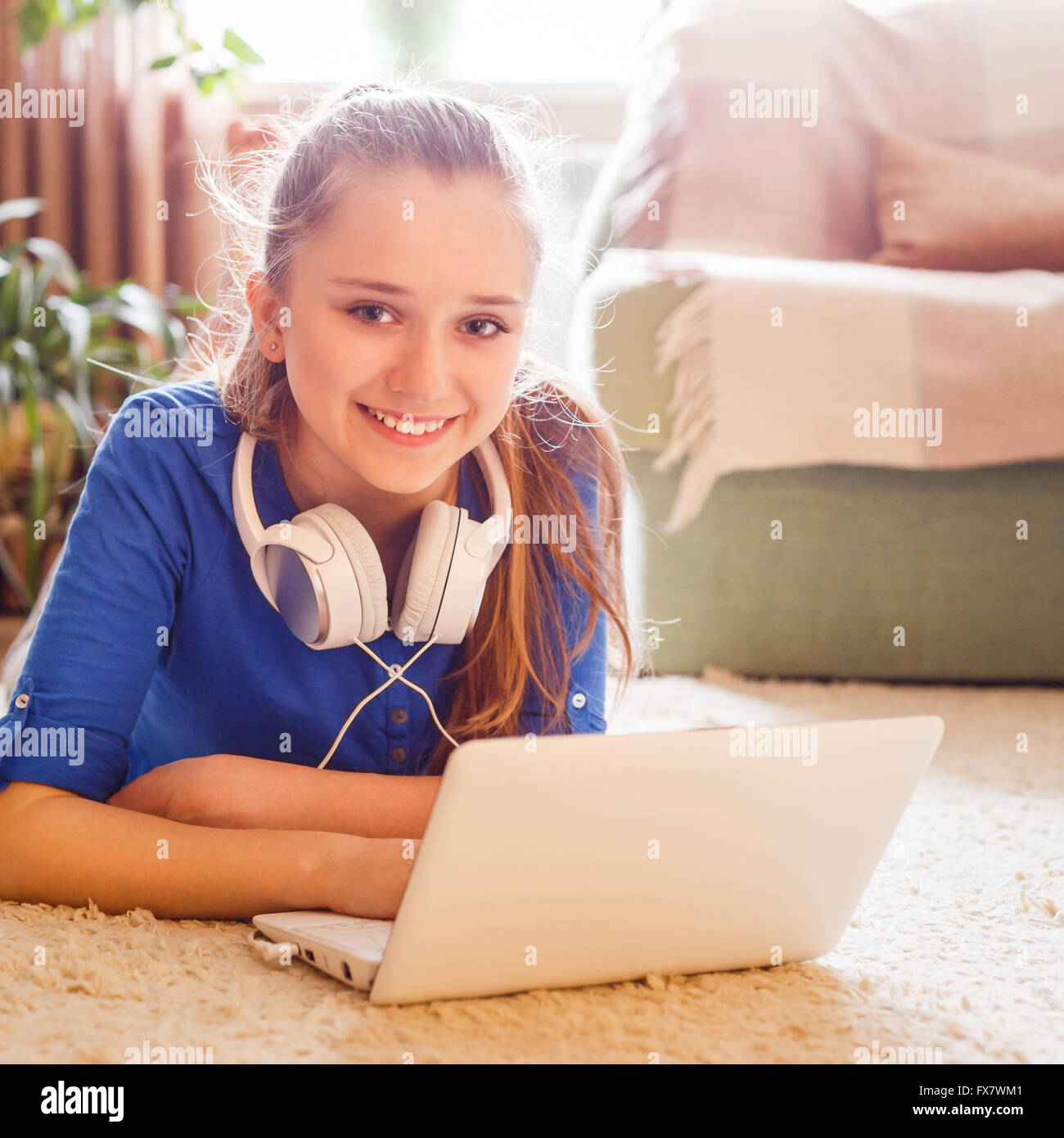 Young caucasian teenage girl having fun using laptop at her home Stock ...