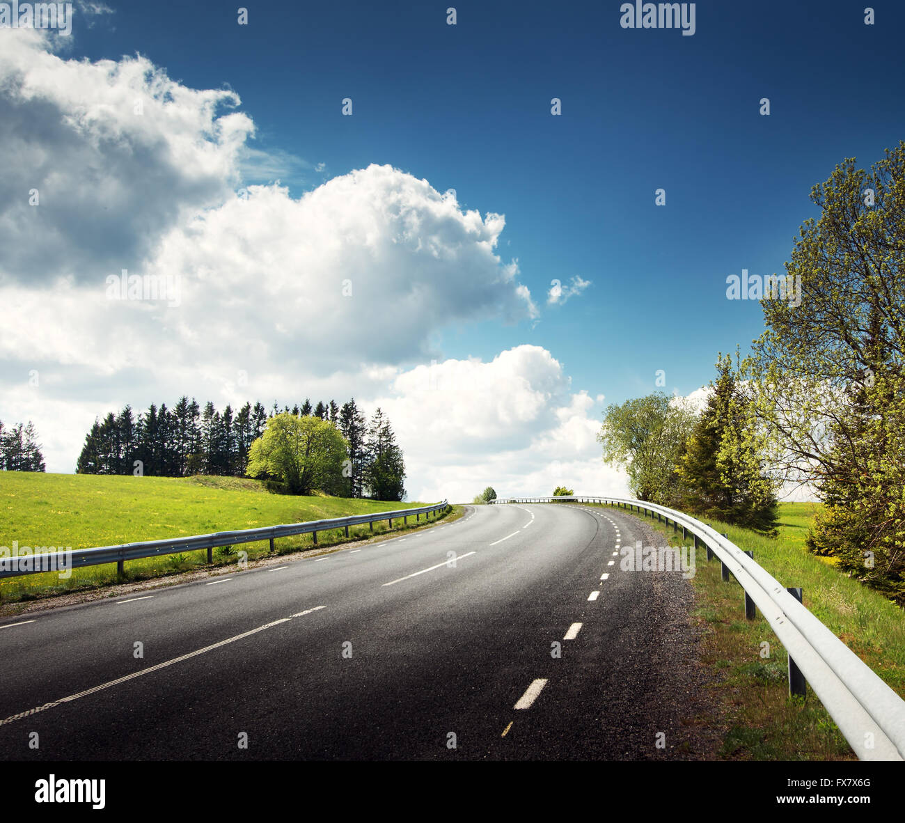 Car on asphalt road in beautiful spring day Stock Photo - Alamy